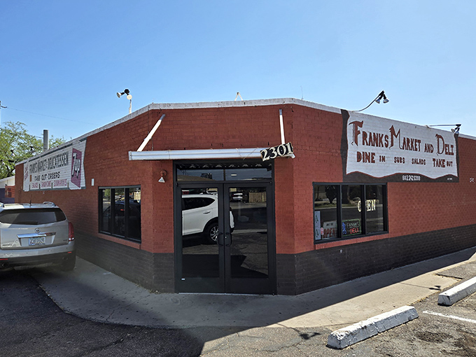 The bright red exterior of Frank's Market and Deli stands like a culinary lighthouse in Phoenix, beckoning sandwich enthusiasts from miles around.
