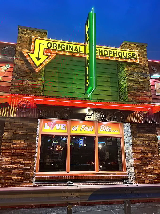 The neon-lit exterior of Manny's Original Chophouse stands like a beacon for carnivores, promising "LOVE at First Bite" beneath its iconic signage.