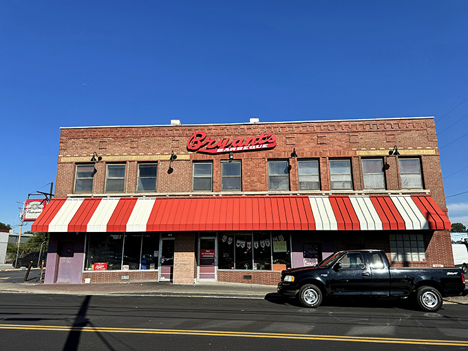 The iconic brick fortress of flavor stands proudly on the corner of 18th and Brooklyn, its red awnings like barbecue battle flags in Kansas City's culinary landscape. 