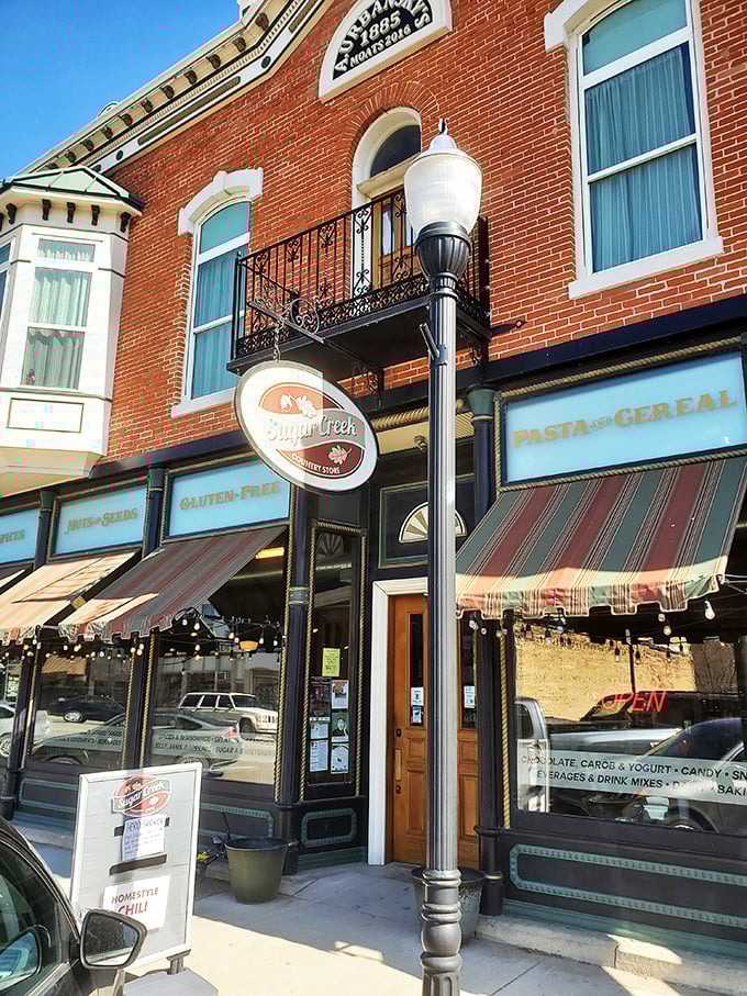 The historic brick façade of Sugar Creek Country Store beckons like an old friend, promising delicious treasures behind that charming wooden door. 