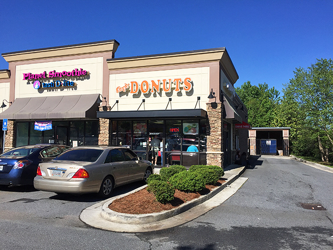 The siren call of that "Donuts" sign hits different at 7am – Ray's storefront promises morning salvation in strip mall form.
