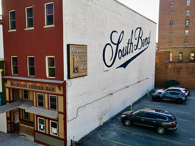 The Madison Oyster Bar stands proudly against South Bend's skyline, a brick beacon of seafood salvation in the heart of Notre Dame country.