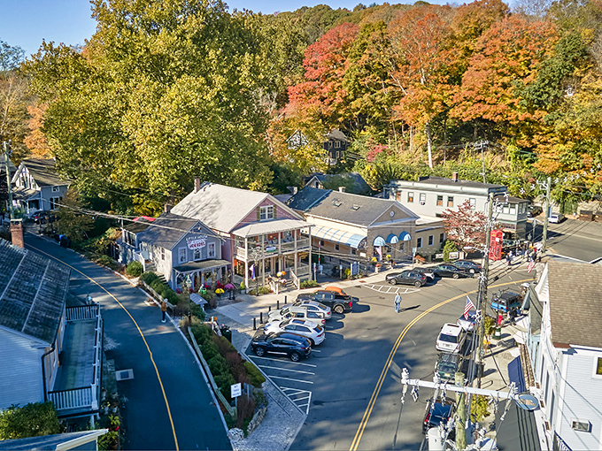 Charming cedar-shingled architecture gives Chester its storybook appeal. This cottage-style shop epitomizes New England charm with seasonal planters adding vibrant color.
