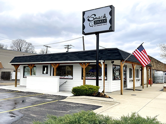 The humble white exterior of The Snack Shack belies the flavor explosions happening inside. American flag included—because patriotism tastes delicious.