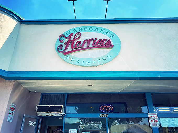 The unassuming storefront of Harriet's Cheesecakes Unlimited in Inglewood – proof that culinary greatness often hides in plain sight behind modest blue trim.