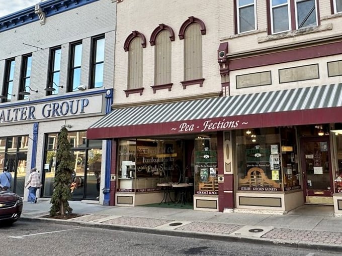 The charming storefront of Pea-Fections beckons from historic downtown Vincennes, promising sweet treasures behind that striped awning and vintage façade.