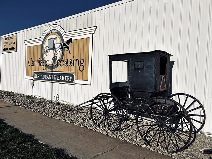 The iconic Carriage Crossing exterior stands proudly against the Kansas sky, complete with an authentic Amish buggy that isn't just for show.