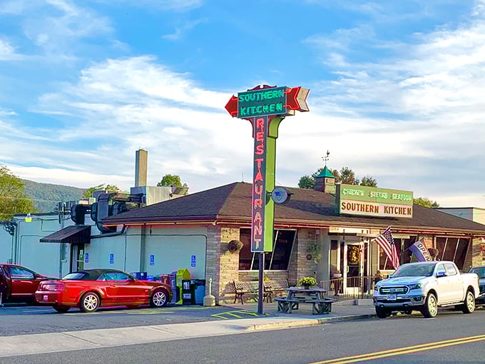 That vintage neon sign isn't just advertising – it's a time machine beckoning you to simpler days when calories didn't count and gravy was a food group.