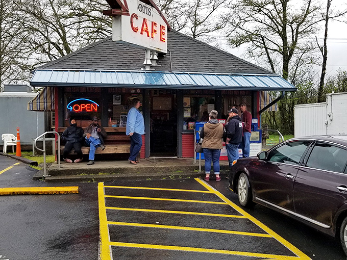 The iconic red exterior of Otis Cafe stands like a beacon of hope for hungry travelers along Highway 18, promising comfort food salvation just minutes from Lincoln City.