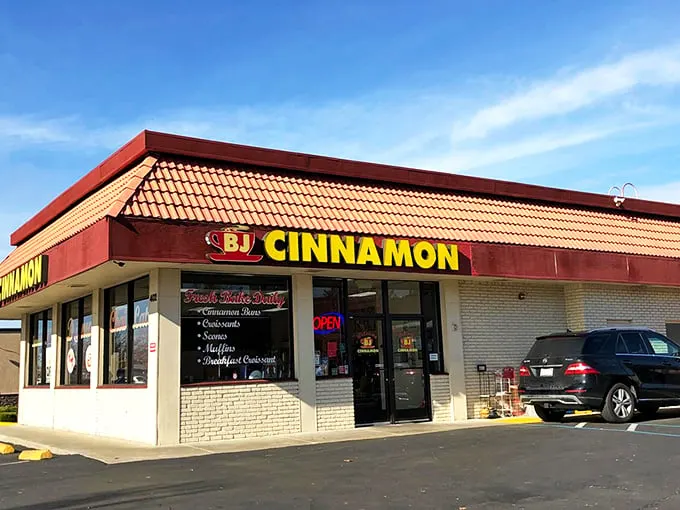 That bright yellow sign isn't just a beacon—it's a promise of pastry perfection waiting inside this unassuming Folsom strip mall gem.