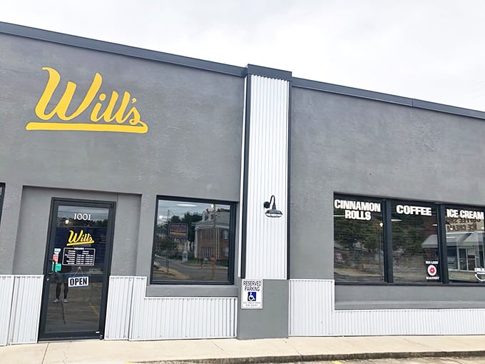 Will's Cinnamon Shop's unassuming gray exterior with bright yellow signage is like Clark Kent – ordinary on the outside, superhero-level deliciousness within.
