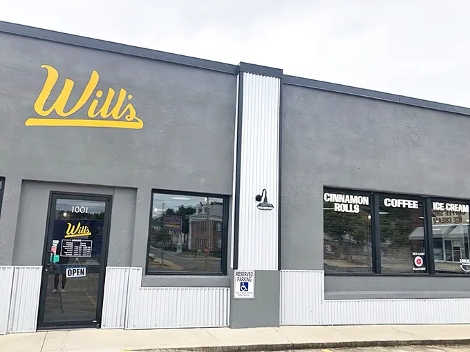 Will's Cinnamon Shop's unassuming gray exterior with bright yellow signage is like Clark Kent – ordinary on the outside, superhero-level deliciousness within.