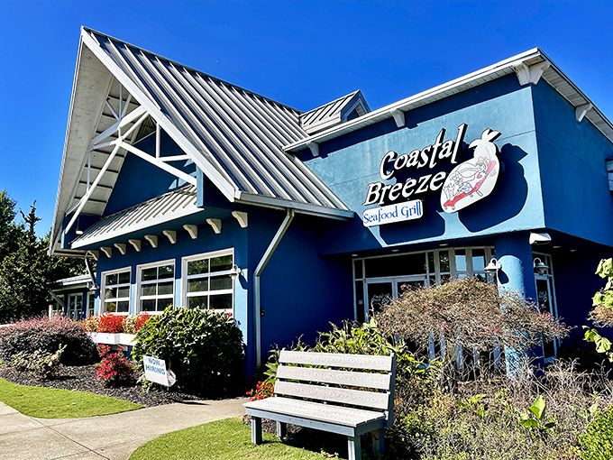 The bright blue exterior of Coastal Breeze stands out like a maritime mirage in landlocked Buford, promising seafood treasures within.