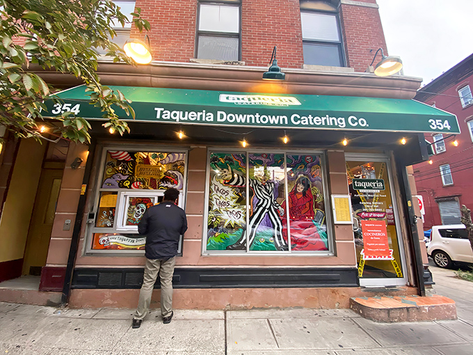The unassuming green awning of Taqueria Downtown Catering Co. hides Jersey City's best-kept culinary secret. Like finding a diamond in your cereal box – unexpected but absolutely thrilling.