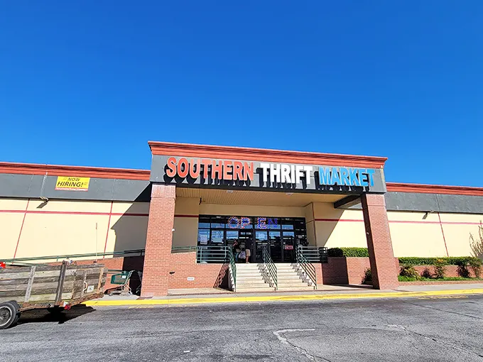 The Southern Thrift Market stands proudly against a blue Georgia sky, its colorful sign promising adventures in secondhand treasures within.
