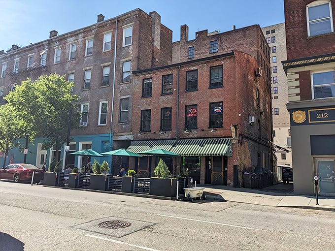 The unassuming exterior of Arnold's Bar & Grill beckons with its vintage charm and green-striped awning—Cincinnati's worst-kept secret hiding in plain sight.