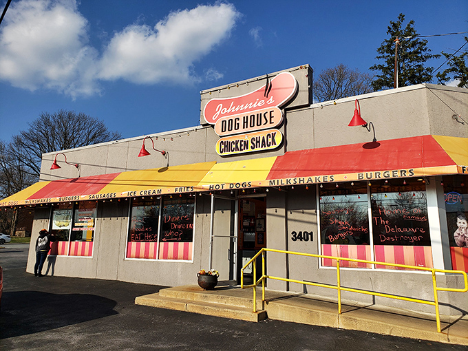The candy-striped awning of Johnnie's beckons like a culinary lighthouse on Concord Pike, promising comfort food treasures within.