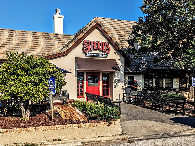 The iconic red doors of Stroud's welcome you like an old friend's embrace – promising comfort and legendary fried chicken inside.