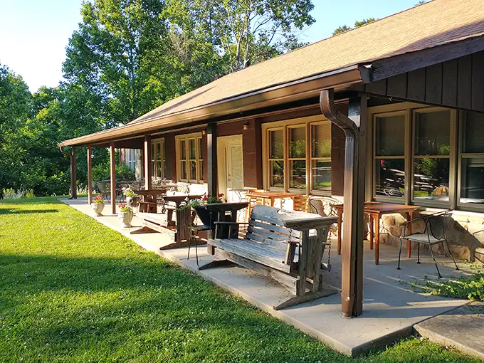 The rustic stone exterior and covered porch of Hilltop Restaurant isn't trying to impress anyone—and that's precisely why it does.