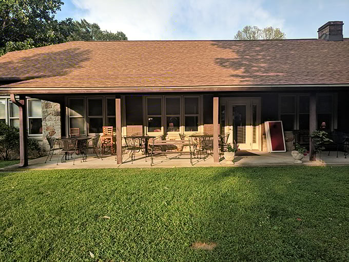The rustic stone exterior and covered porch of Hilltop Restaurant isn't trying to impress anyone—and that's precisely why it does.