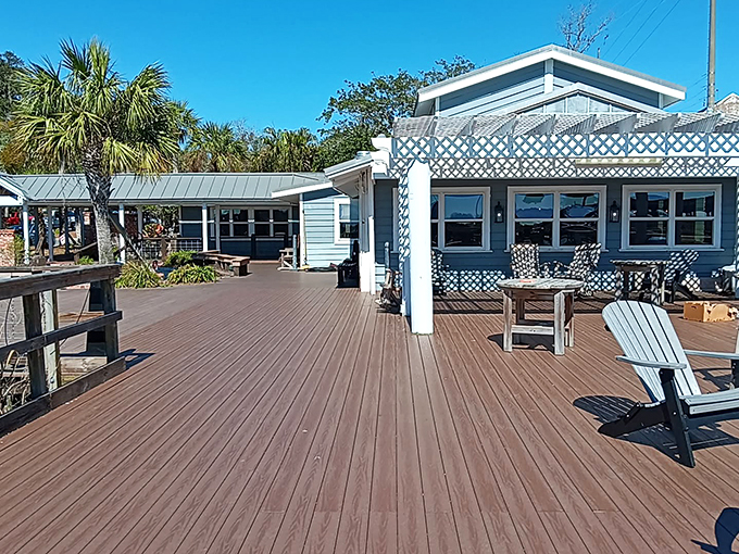 The wooden deck at Skipper's Fish Camp invites you to slow down and breathe in that coastal air. Those rocking chairs aren't just furniture—they're an invitation to linger.