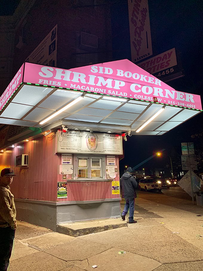 The neon-pink beacon of Sid Booker's illuminates the Philadelphia night like a seafood lighthouse, calling hungry travelers home to shrimp paradise.