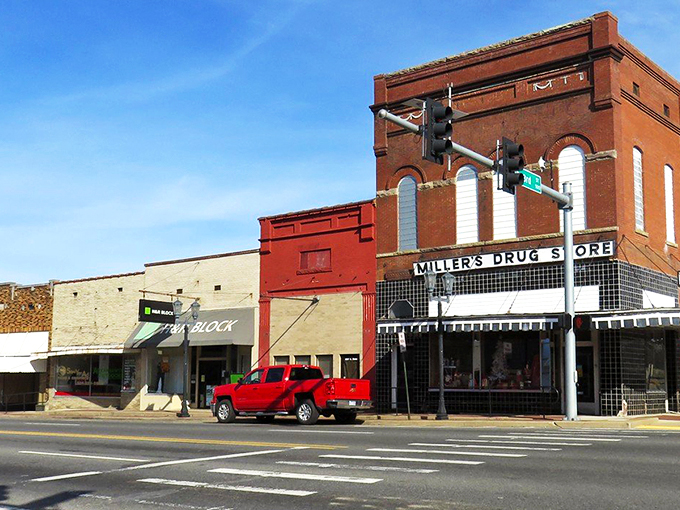 Malvern's Main Street at dusk captures that perfect small-town moment when the streetlights flicker on and the brick buildings glow with warmth and history.