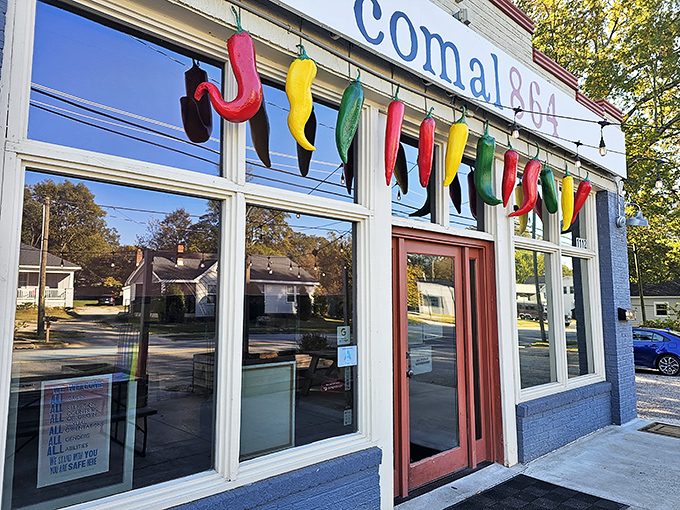 The colorful chili pepper garland hanging above Comal 864's entrance isn't just decoration—it's a preview of the flavor fiesta waiting inside.