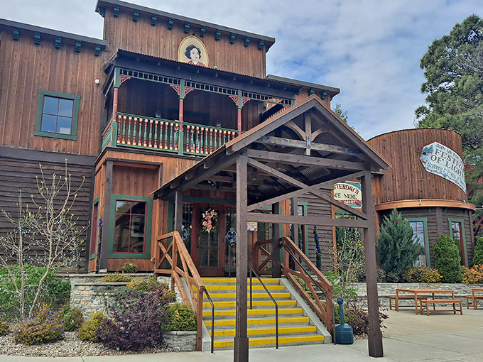 The rustic wooden exterior of Patti's 1880's Settlement welcomes visitors with its charming green trim and distinctive yellow steps—architectural comfort food for the soul.
