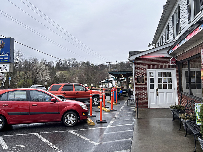 Even on a rainy day, Baugher's welcomes hungry travelers with its charming entrance and colorful parking bollards – a roadside beacon of comfort food paradise.