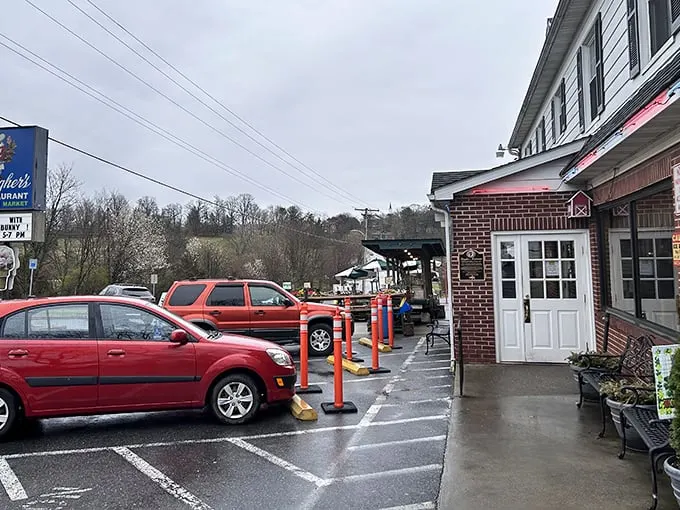 Even on a rainy day, Baugher's welcomes hungry travelers with its charming entrance and colorful parking bollards – a roadside beacon of comfort food paradise.