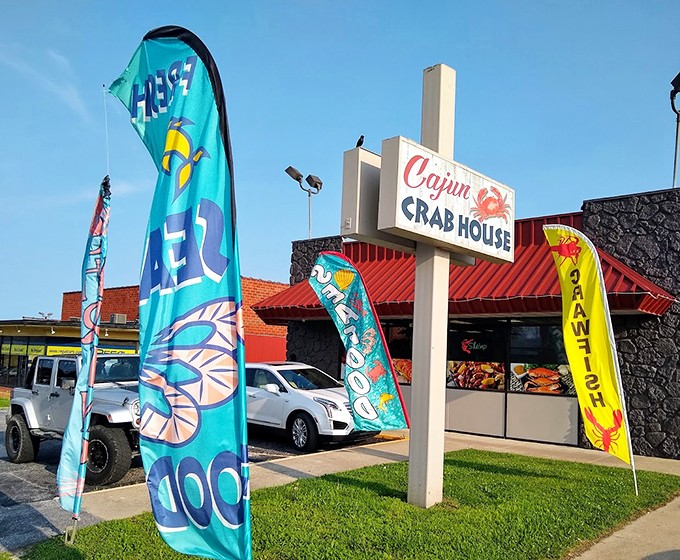 The colorful flags outside Cajun Crab House dance in the Missouri breeze like maritime semaphores signaling seafood salvation in the most landlocked of places.