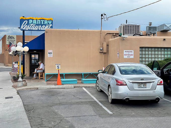 That iconic blue awning against adobe walls isn't just a sign—it's a beacon of breakfast hope for hungry Santa Feans who know the early bird gets the huevos.