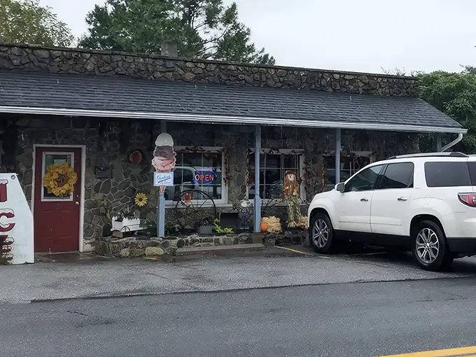 The stone facade of Country Café stands like a culinary time capsule in Harpers Ferry, promising comfort food treasures within its unassuming walls.