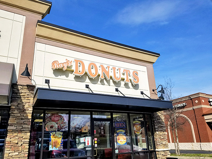 The siren call of that "Donuts" sign hits different at 7am – Ray's storefront promises morning salvation in strip mall form.
