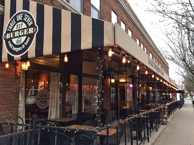 The iconic black and gold striped awning of 317 Burger beckons hungry travelers like a lighthouse for the famished. "Craft Burgers & Beer" isn't just a promise—it's a mission statement.