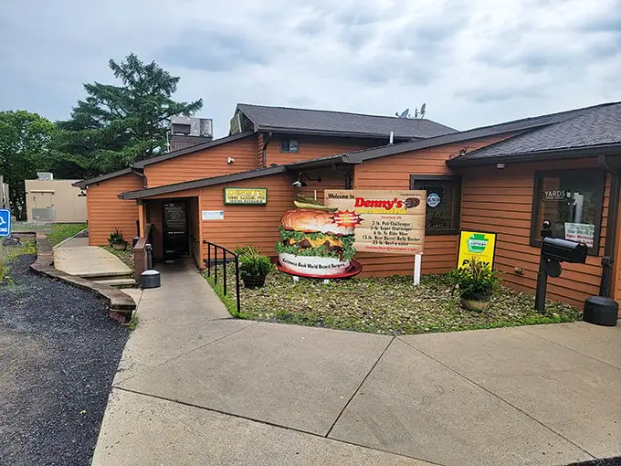 The unassuming wooden exterior of Denny's Beer Barrel Pub – where burger legends are born and diets go to die.