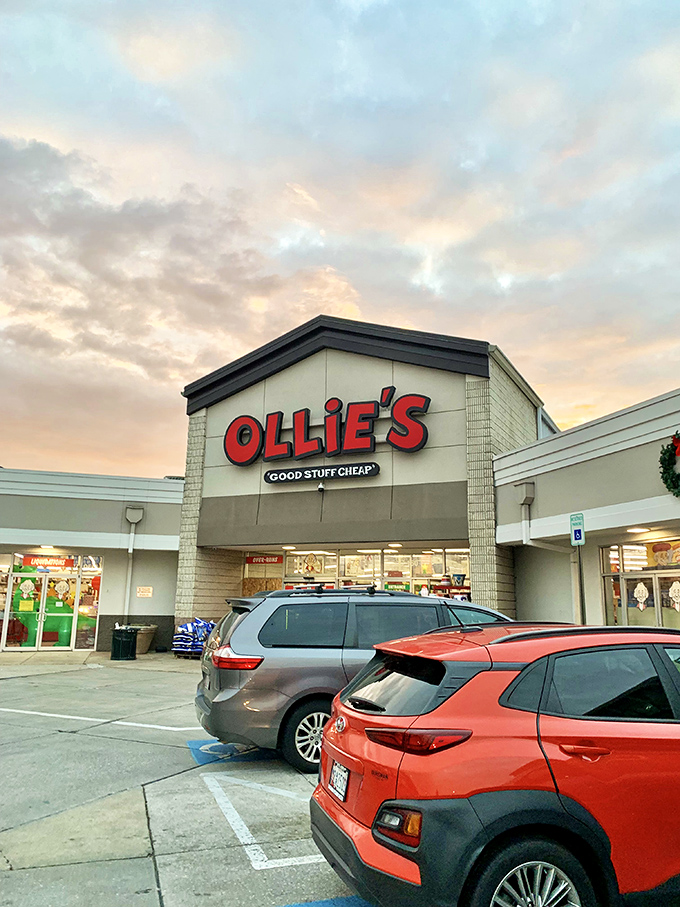 The iconic red Ollie's sign promises "GOOD STUFF CHEAP" – a siren call to bargain hunters that's impossible to resist.