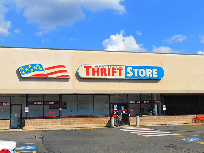 The patriotic facade of Red White & Blue Thrift Store stands proudly against a blue Connecticut sky, like a bargain-hunter's version of the Promised Land.