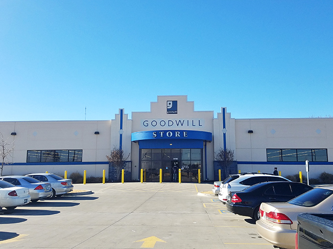 The iconic blue and white facade of Goodwill on Southwest Boulevard stands like a beacon for bargain hunters under Oklahoma's expansive sky.