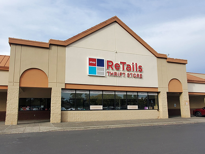 A rainbow arches over ReTails Thrift Store like nature's own "Grand Opening" banner, promising treasures at the end of your bargain-hunting journey.