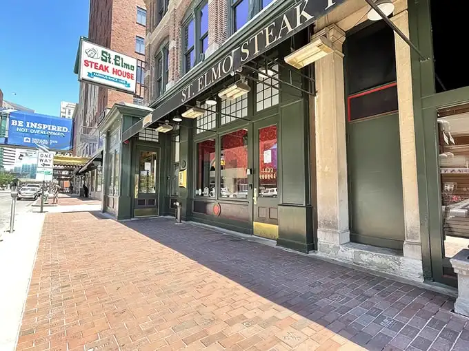 The historic brick façade of St. Elmo Steak House stands proudly on Illinois Street, a culinary landmark that's been tempting Indianapolis carnivores for generations.