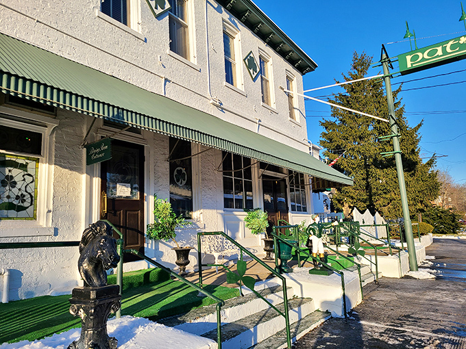 The unassuming green exterior of Pat's Steakhouse hides culinary greatness like a superhero's secret identity. That modest sign has guided hungry Louisvillians for generations.