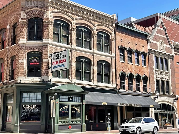 The historic brick façade of St. Elmo Steak House stands proudly on Illinois Street, a culinary landmark that's been tempting Indianapolis carnivores for generations.