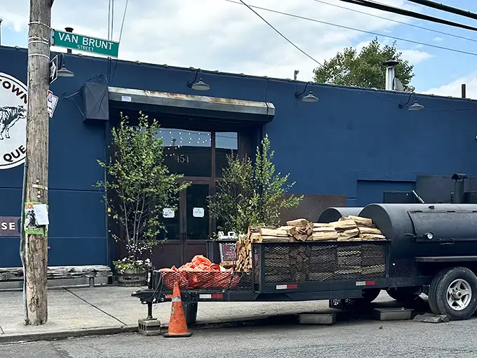The blue exterior of Hometown Bar-B-Que stands like a beacon for meat pilgrims, promising smoky salvation inside this unassuming Brooklyn treasure