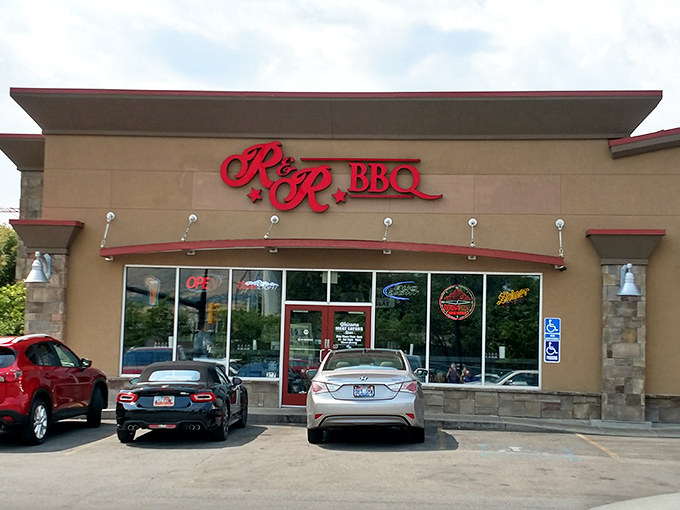 The red R&R BBQ sign beckons like a smoky siren call against the Utah sky. Simplicity on the outside belies the flavor explosion waiting within.