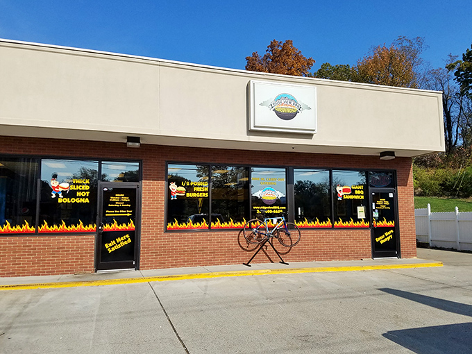 The flames painted along the storefront aren't just decoration—they're a warning to your diet plans. Ridge View BBQ's exterior promises smoky delights within.