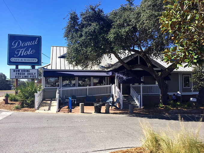 The white picket fence leading to donut paradise isn't just charming—it's a warning that your diet plans are about to be gloriously derailed.