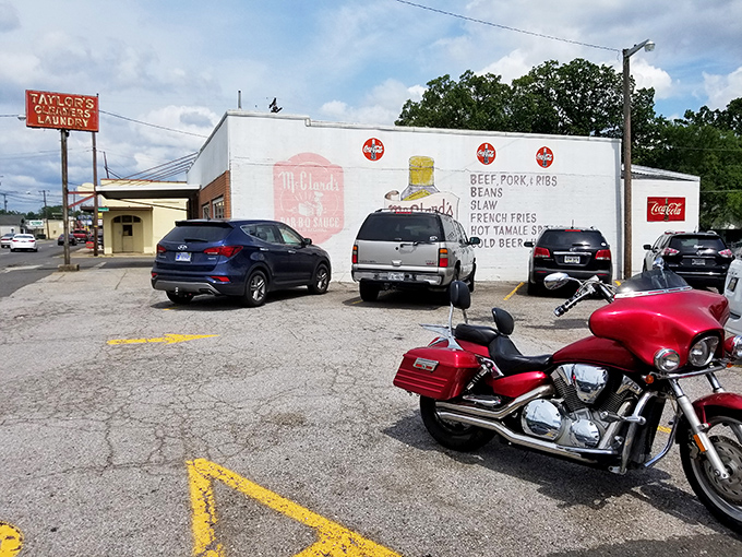 The unassuming white cinderblock exterior of McClard's—proof that in barbecue, as in life, it's what's inside that counts.