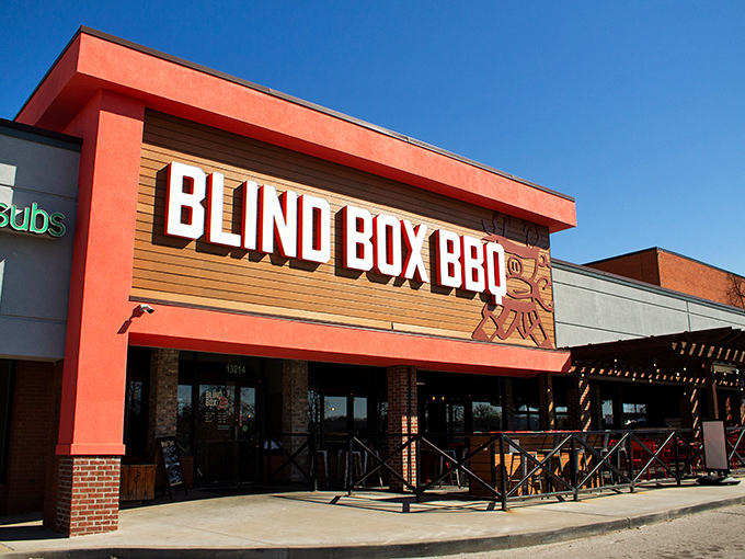The bright orange facade of Blind Box BBQ stands out like a beacon for hungry barbecue pilgrims. No smoke signals needed—you can smell the goodness from the parking lot.